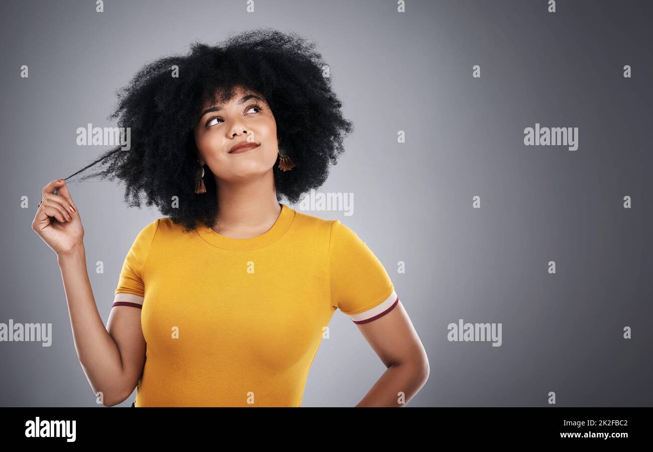 Her hair is bold and her confidence is beautiful. Studio shot of an ...