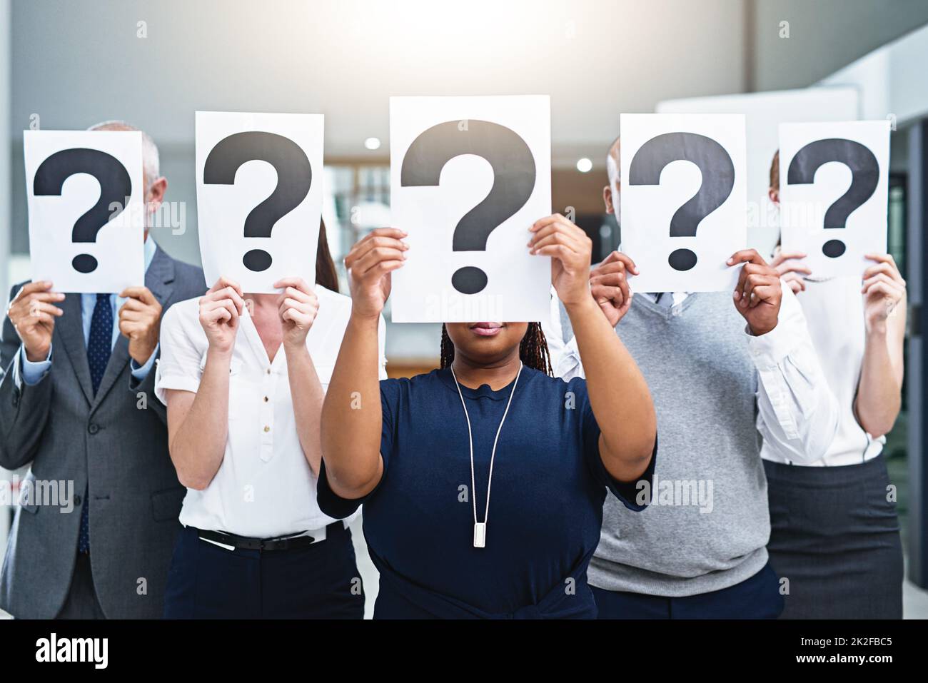 Business team holding question marks hi-res stock photography and ...