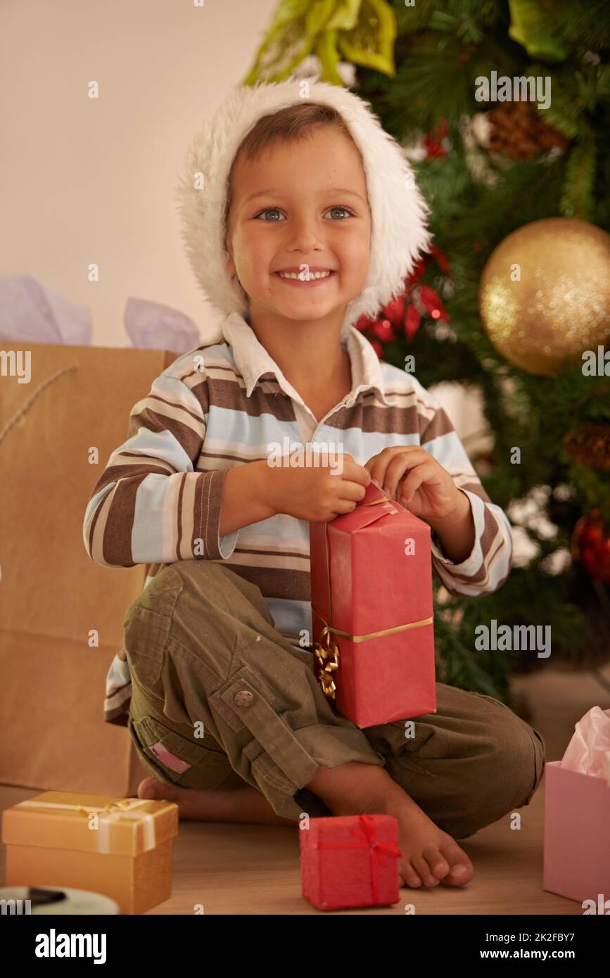 Boy opening gift hi-res stock photography and images - Alamy