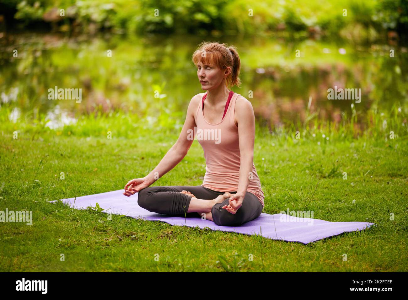 Meditation in a park hi-res stock photography and images - Alamy