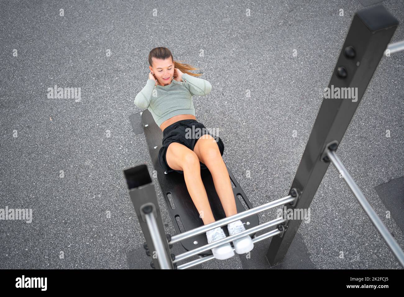 Sit-ups exercises. Active, fit sporty woman doing situps, exercising ...