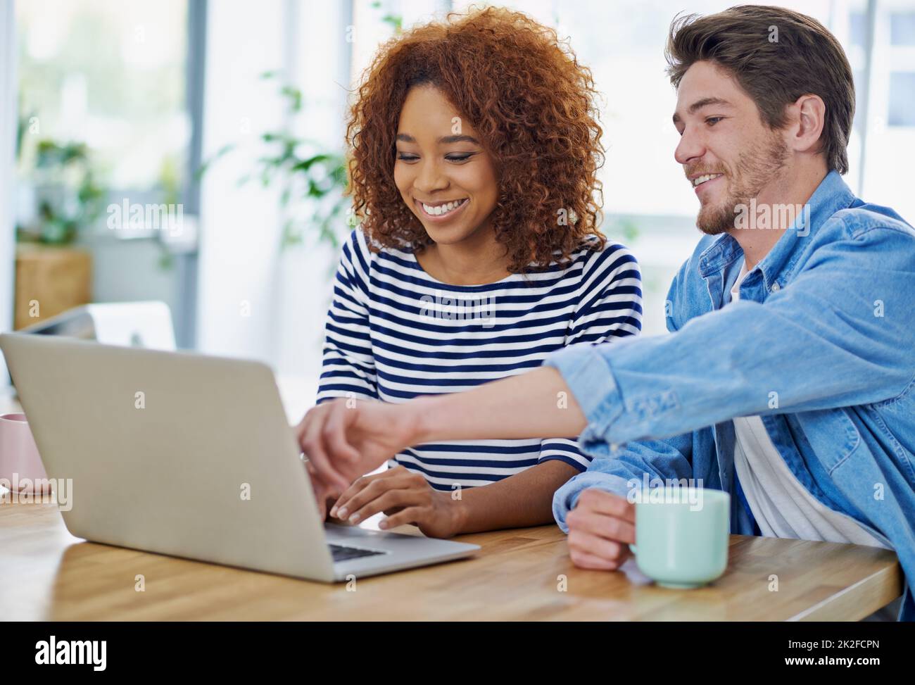 Together you can achieve so much. Shot of two coworkers working ...