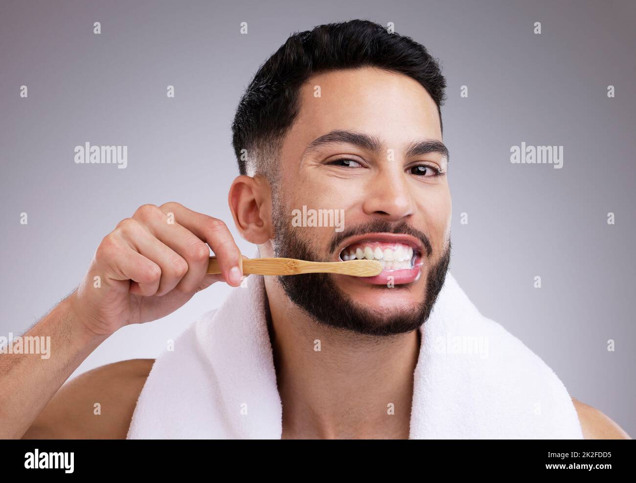 Brushing my way to a brighter smile. Shot of a handsome young man ...