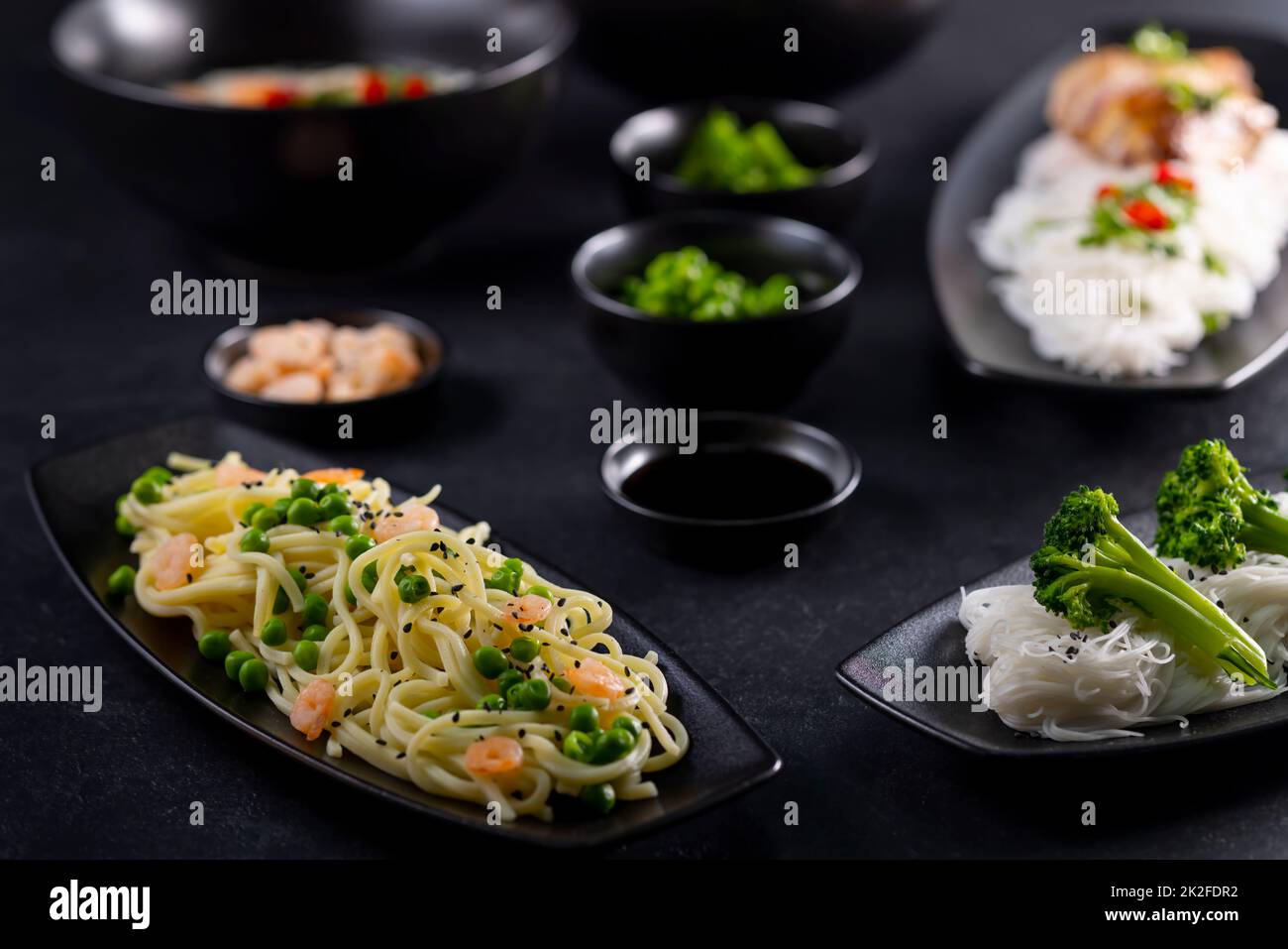 Various dishes of Asian cuisine with different types noodles and rice ...
