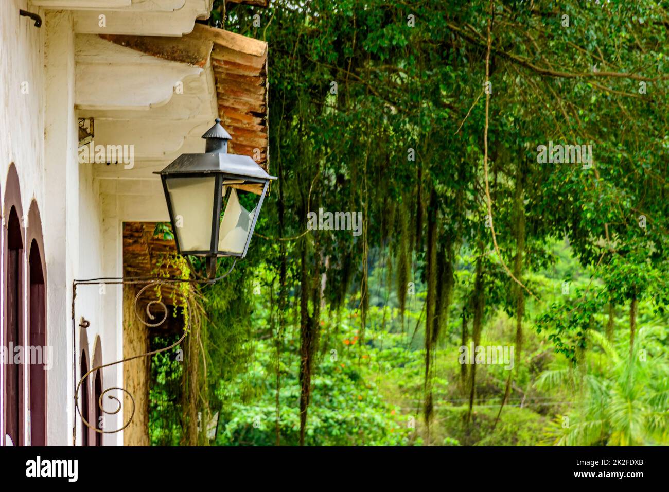 Colonial style house facades with old metal lantern Stock Photo - Alamy