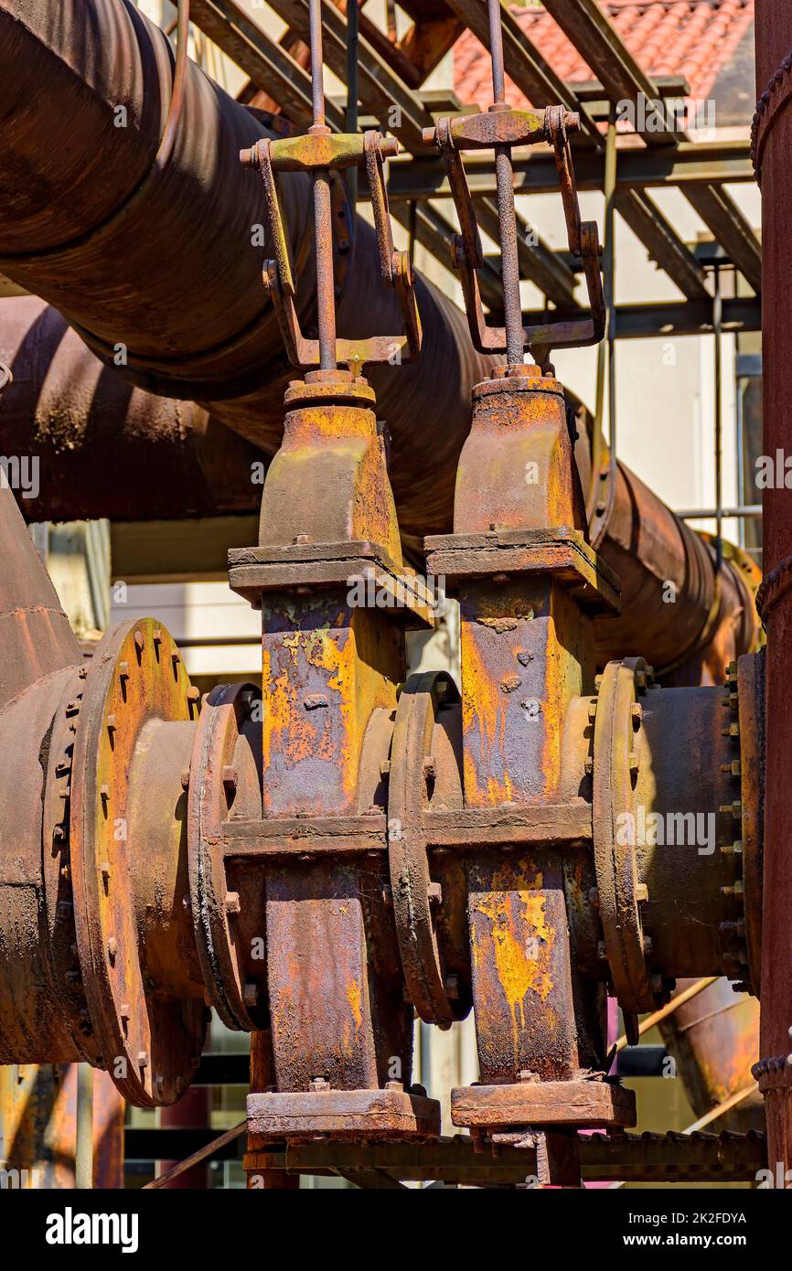 Corroded and rusty gears and piping from abandoned machinery Stock ...