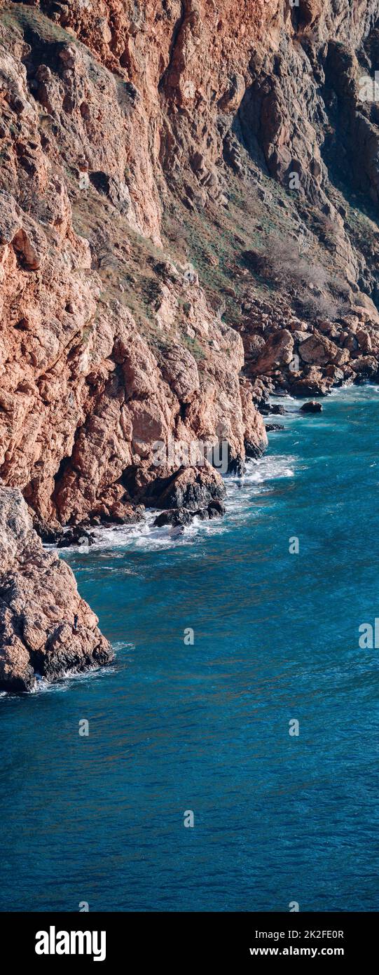 Landscape sea and rocks. The sea is an amazing blue color with ...