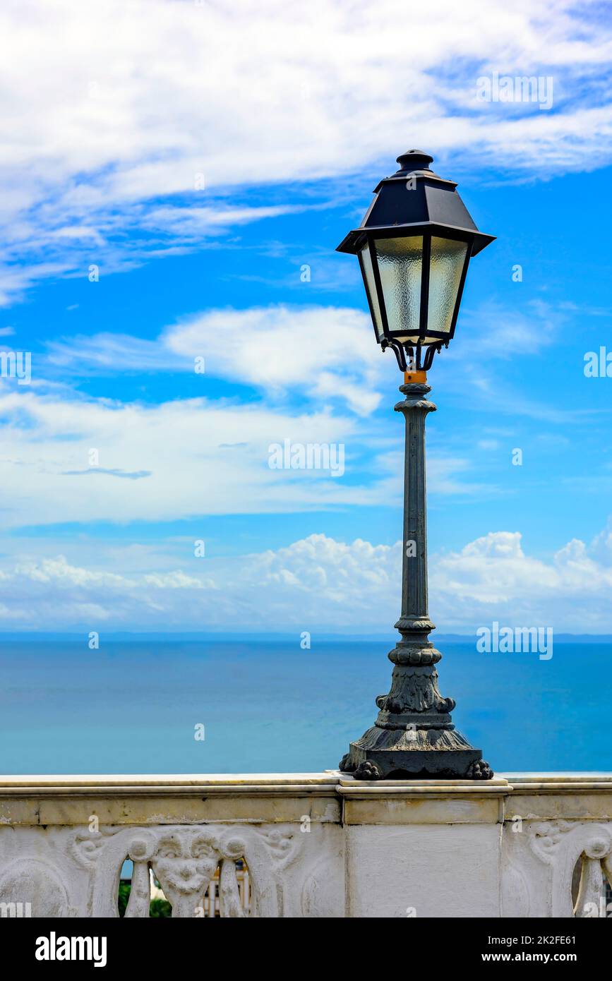 Light pole with ocean in background Stock Photo - Alamy