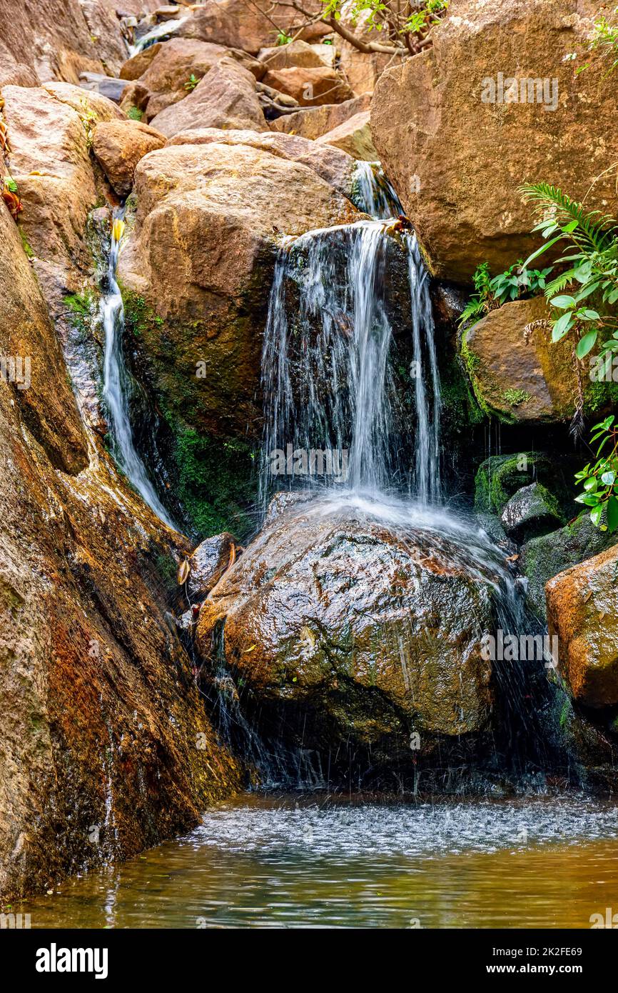 Little waterfall between stones Stock Photo - Alamy