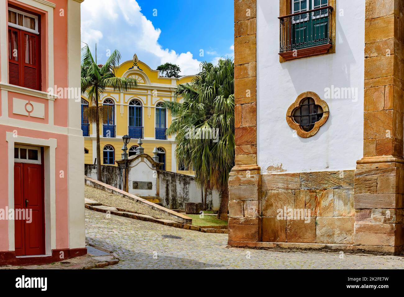 Old cobblestone street with colonial style buildings Stock Photo - Alamy