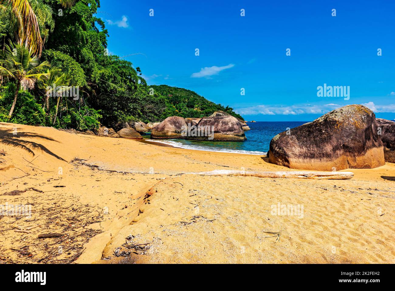 Paradisiacal and deserted beach with colorful waters surrounded by ...