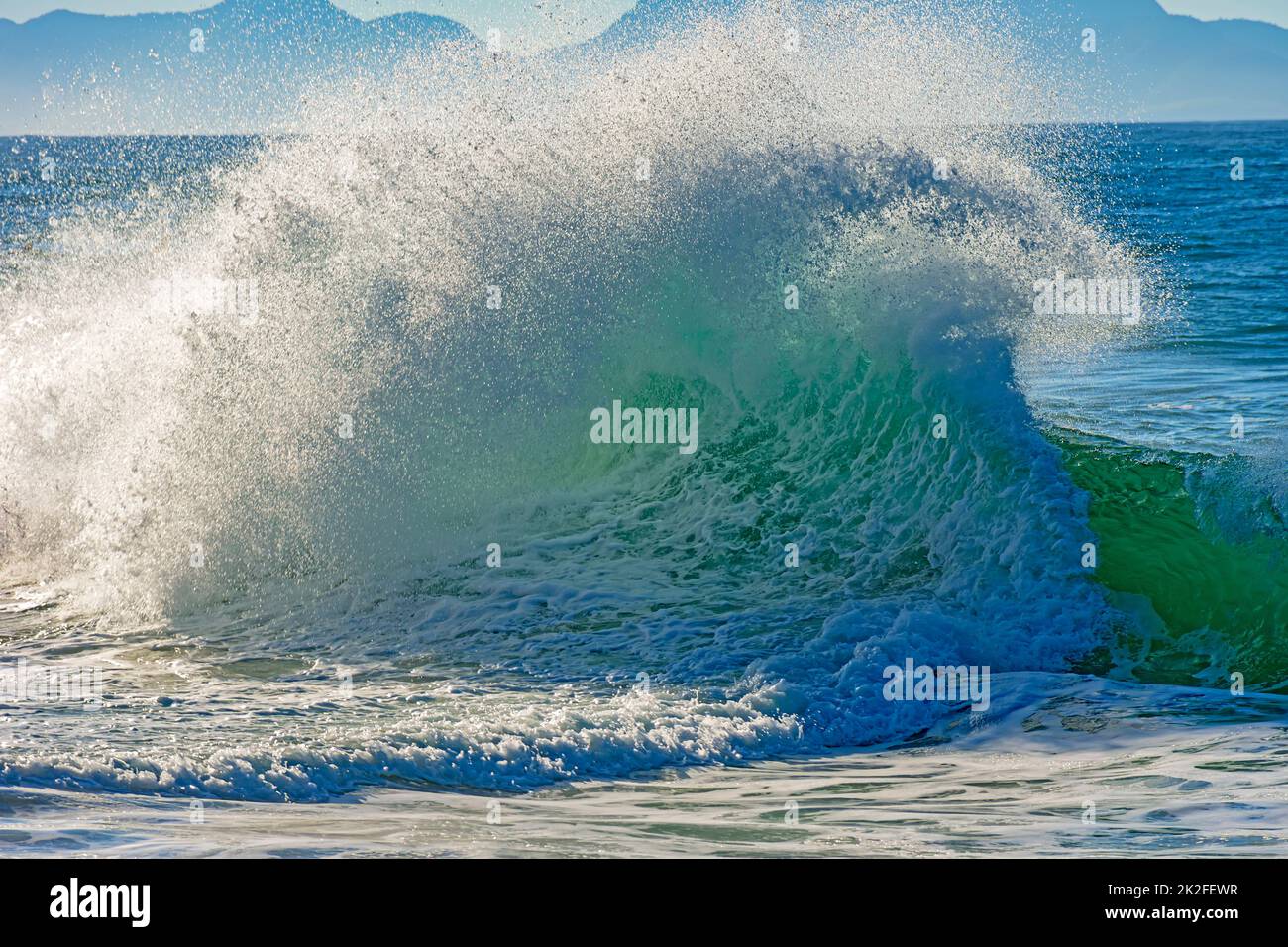 Wave breaking at beach Stock Photo - Alamy