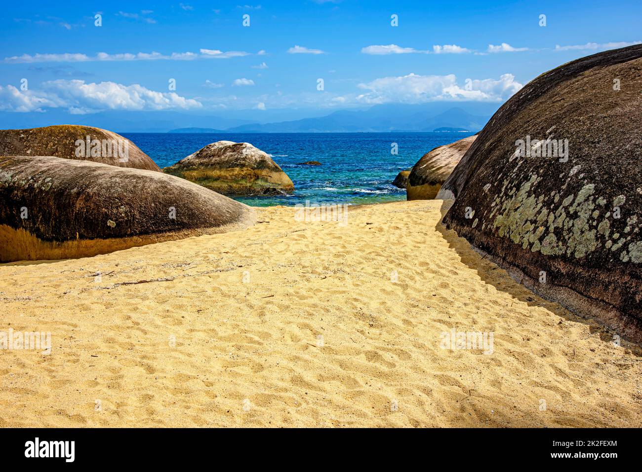 Paradisiacal beach surrounded by rocks on Ilha Grande Stock Photo - Alamy