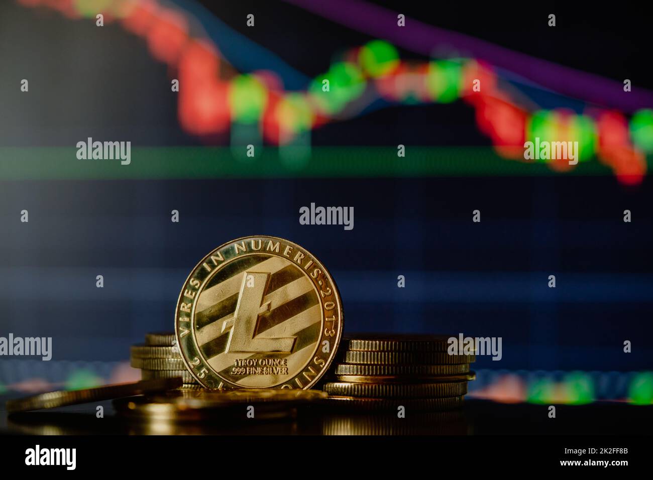 Gold Litecoin with candle stick graph chart and digital background ...