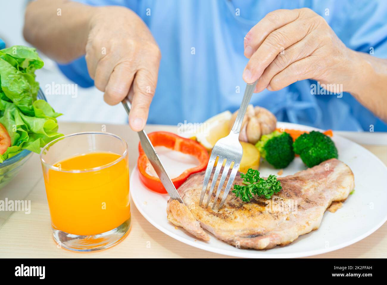 Man eating on hospital bed hi-res stock photography and images - Alamy