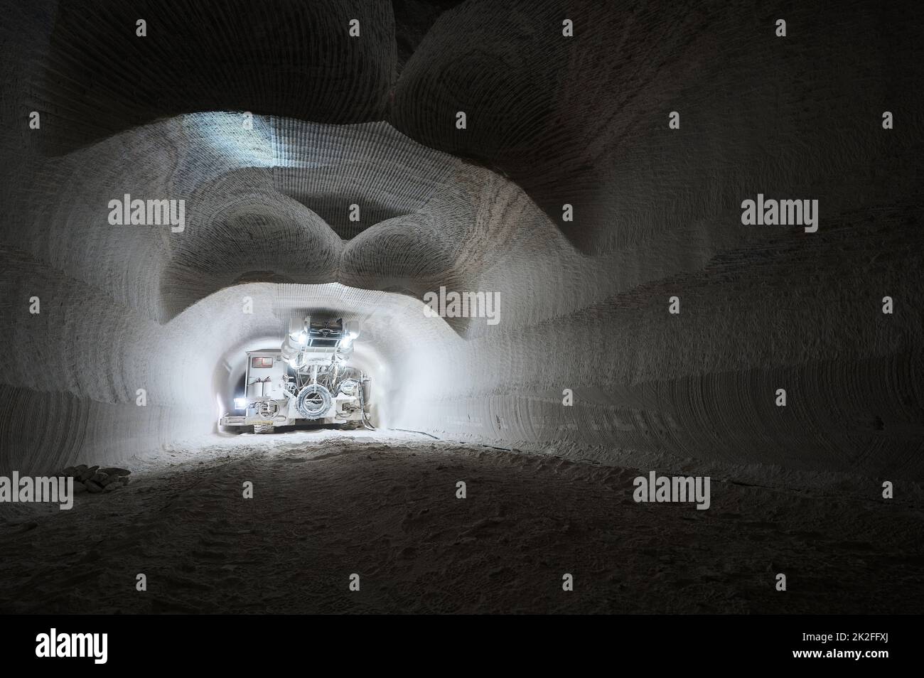Mining drilling machine works in tunnel of salt quarry Stock Photo - Alamy