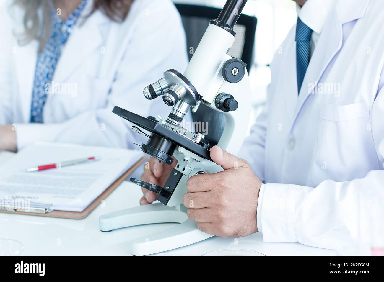 Scientists are researching and recording in science laboratories Stock ...