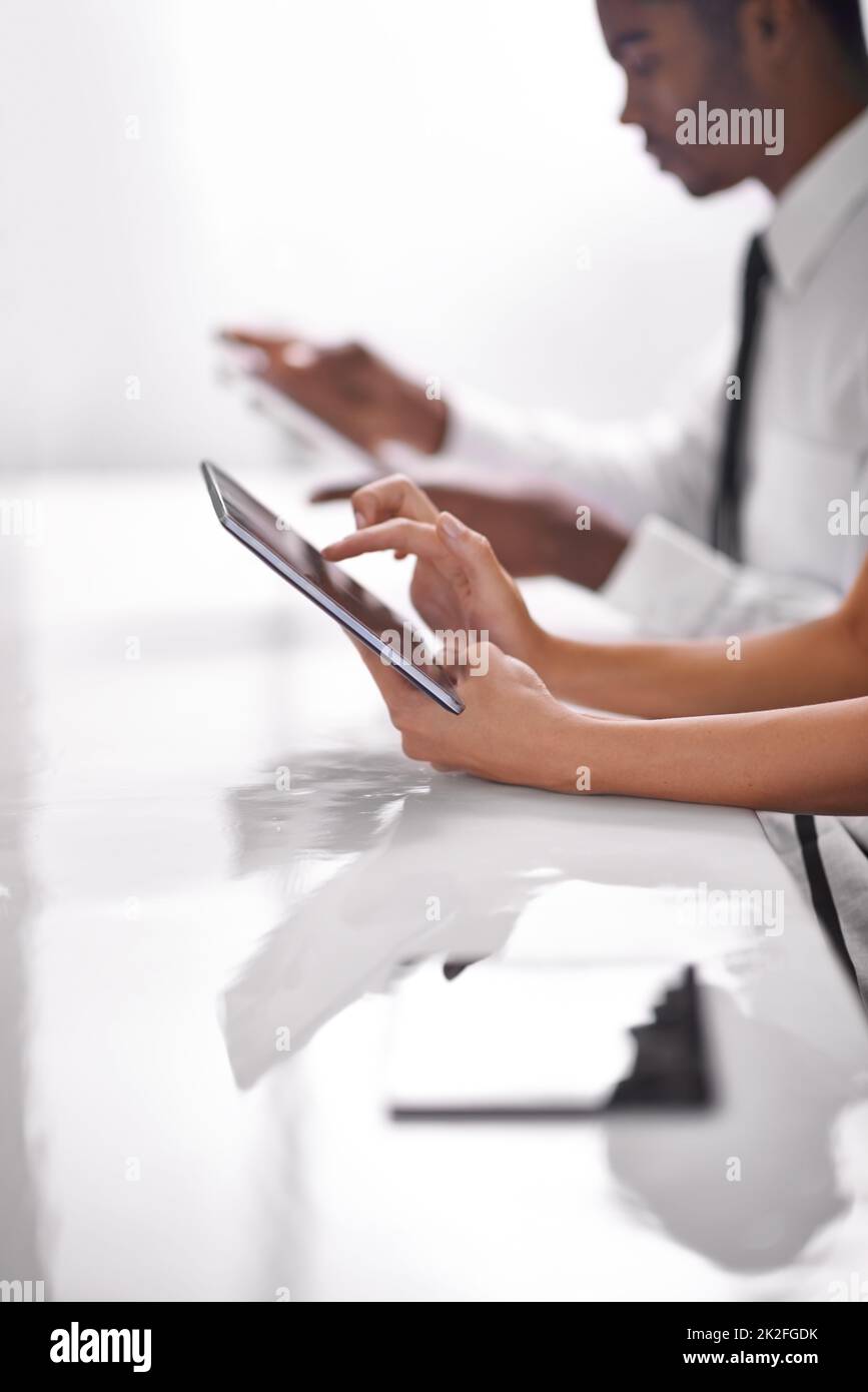 Better technology for better solutions. two businesspeople using their ...