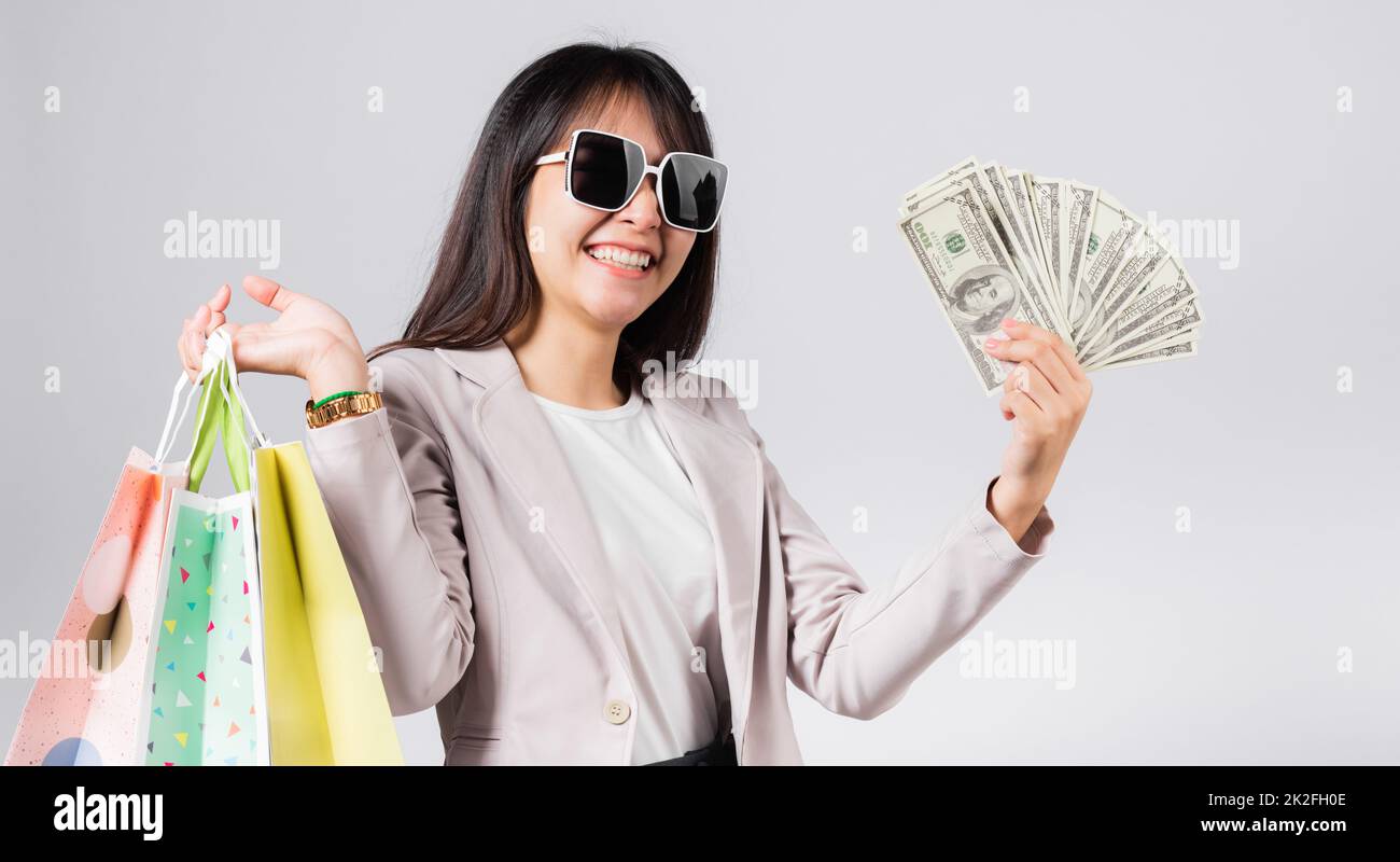 Woman with glasses confident shopper smile holding online shopping bags ...