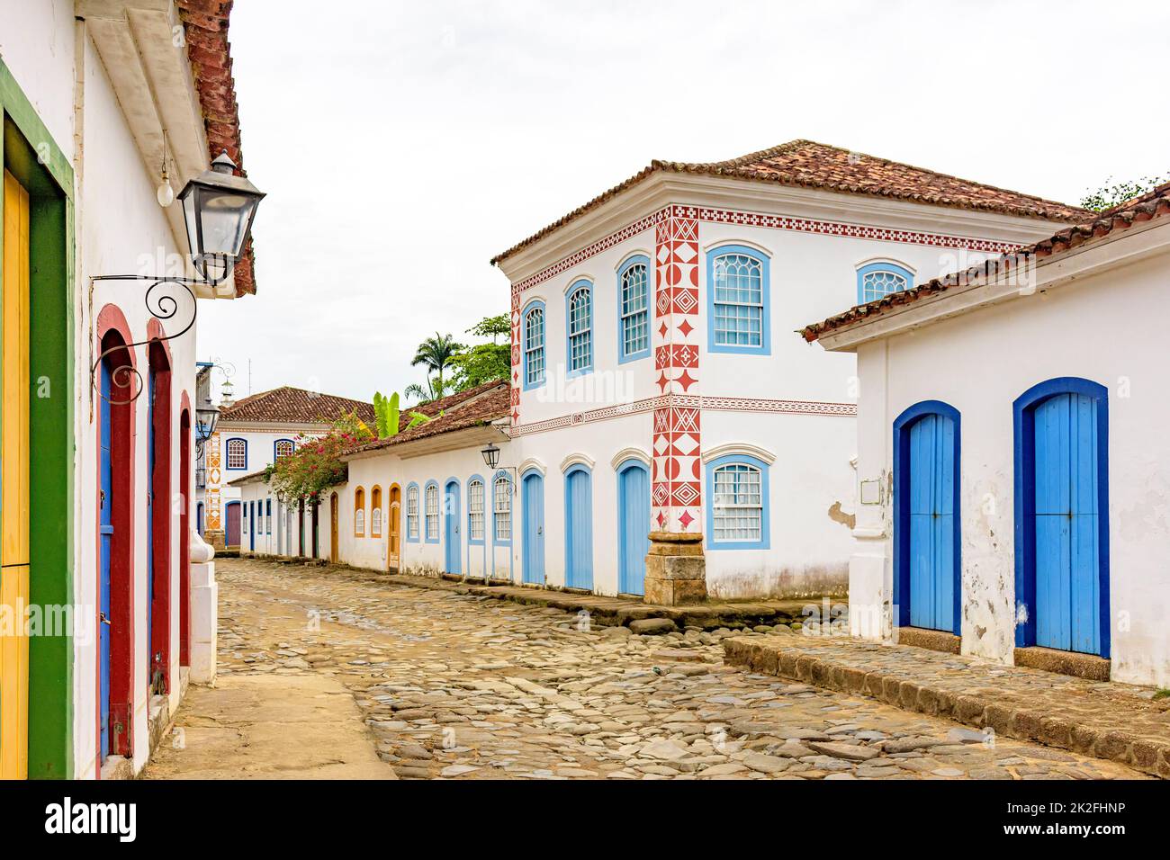 Streets with cobblestone pavement with old houses in colonial style in ...