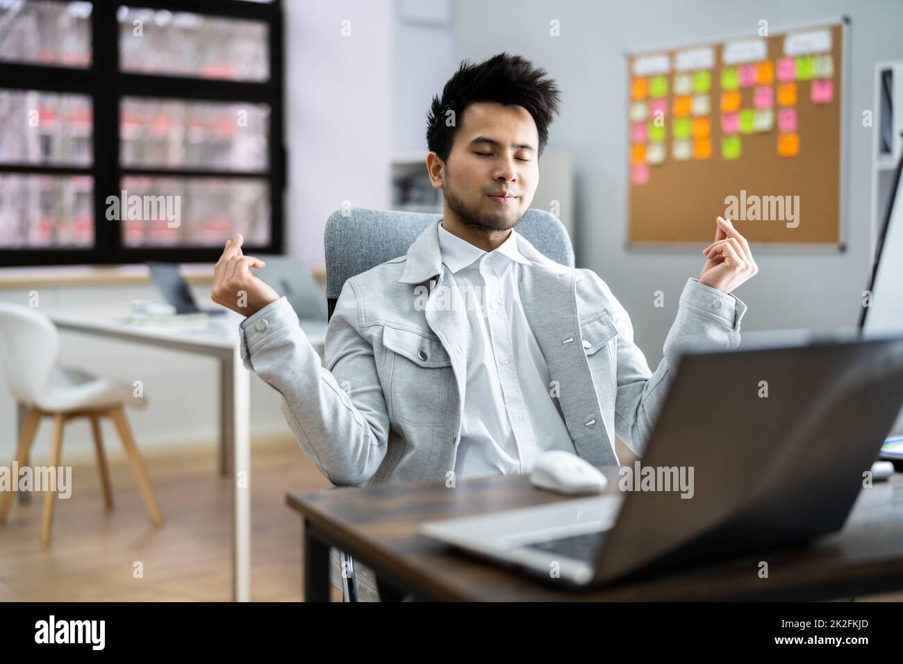 Yoga Meditation In Office Stock Photo - Alamy