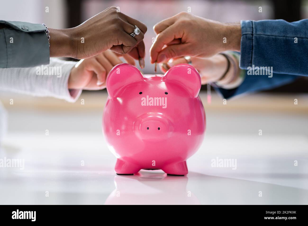 Crowdfunding Concept. People Inserting Coins Into Stock Photo - Alamy