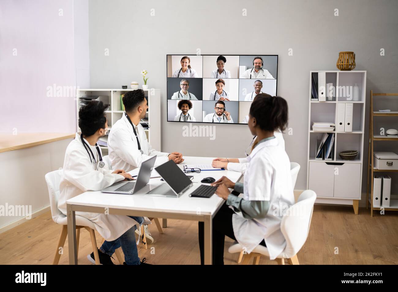 Doctor In Online Medical Video Conference With Diverse Team Of Hospital ...