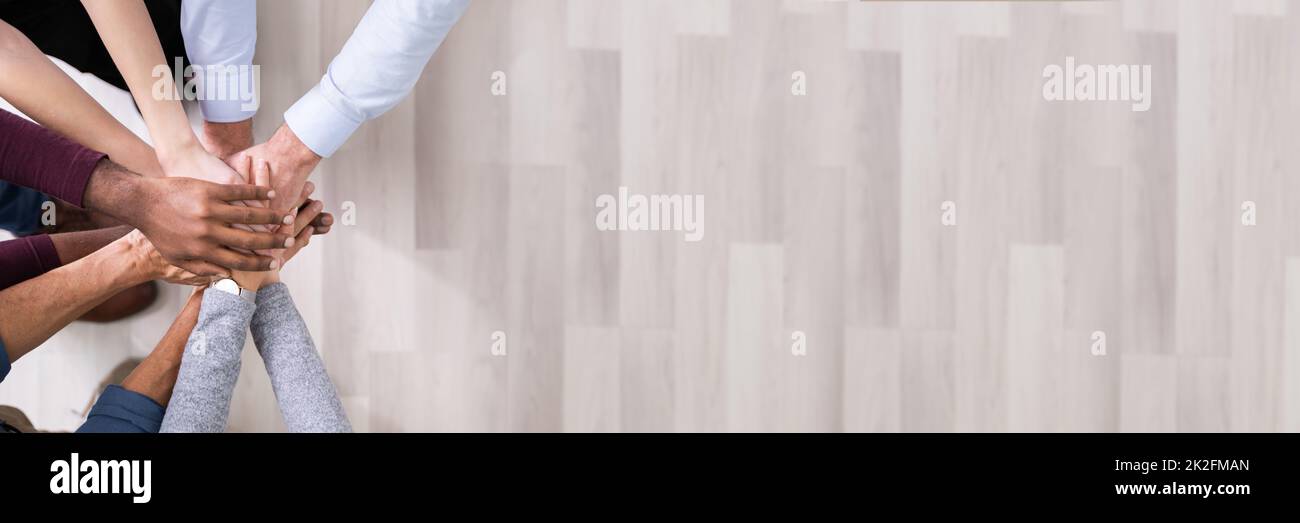 Many hands stacked hi-res stock photography and images - Alamy