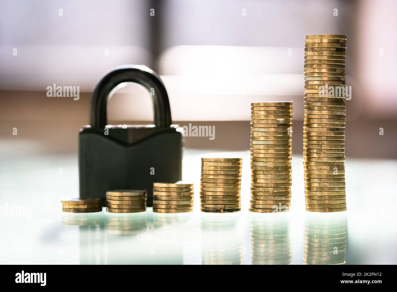 Salary Protection And Money Security. Coin Stack Stock Photo - Alamy