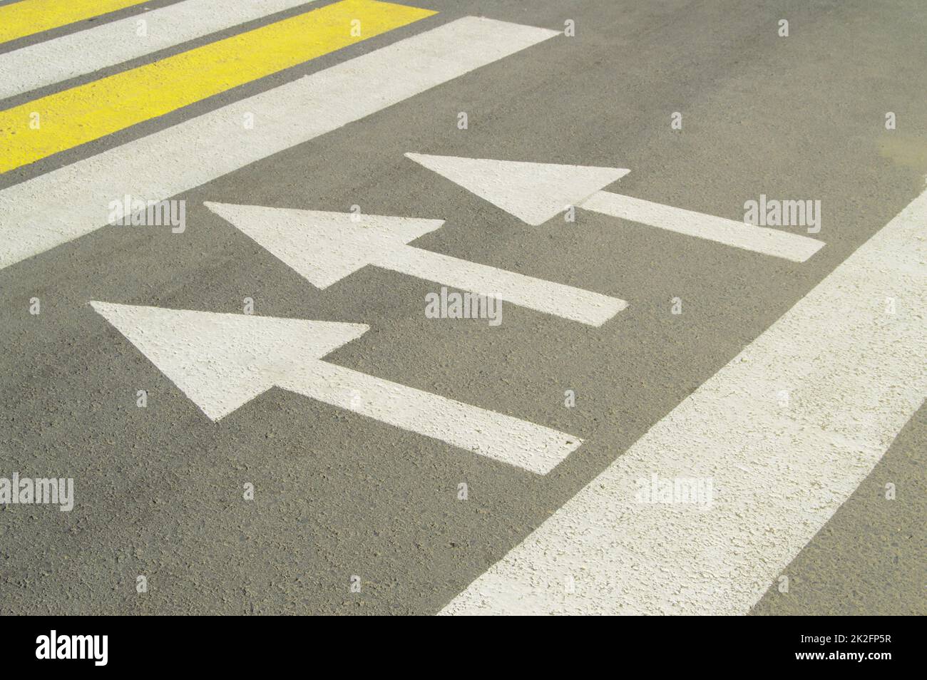Asphalt road with arrow sign shows the direction of movement Stock ...