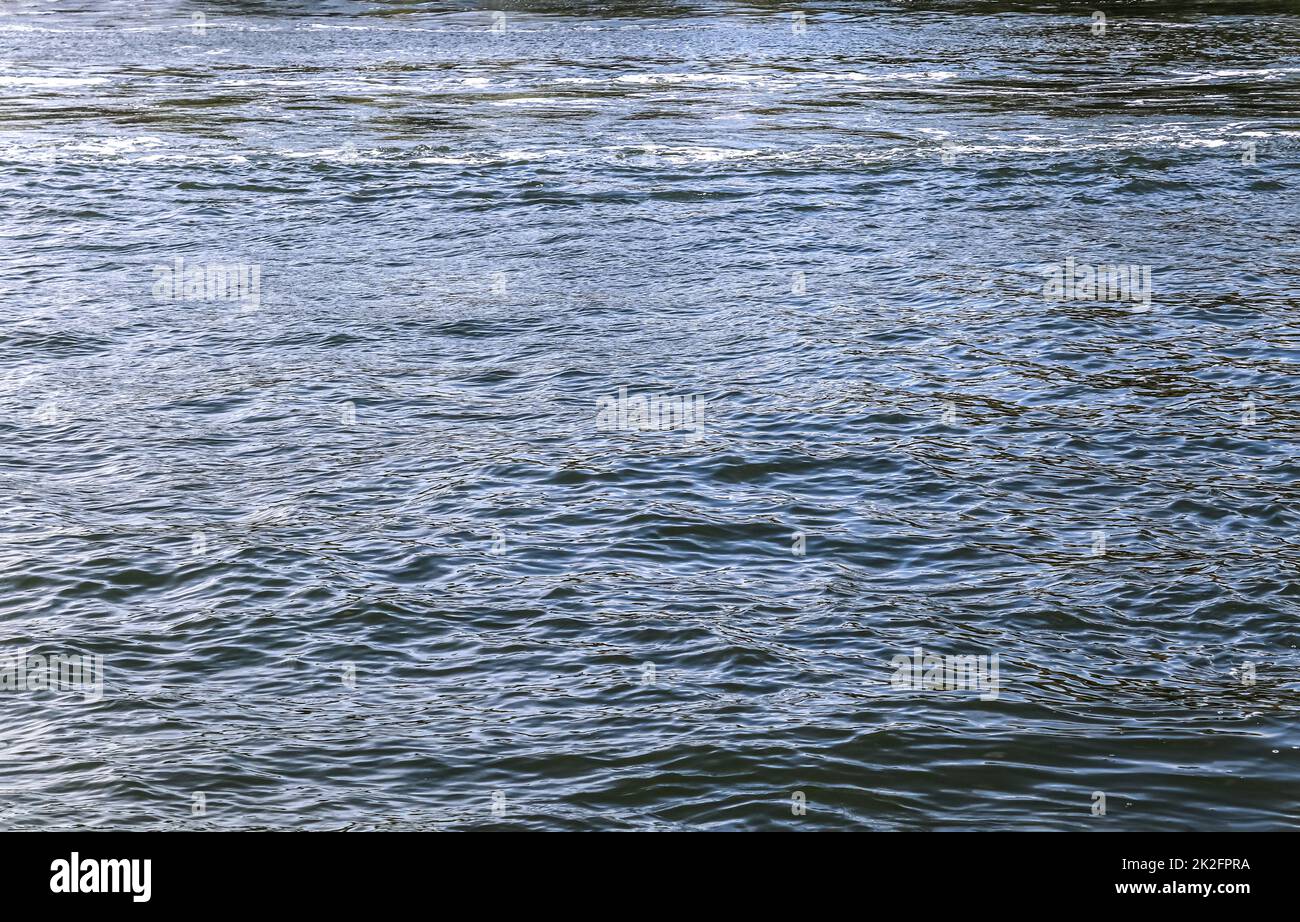 Water surface with waves and ripples and the sunlight reflecting Stock ...