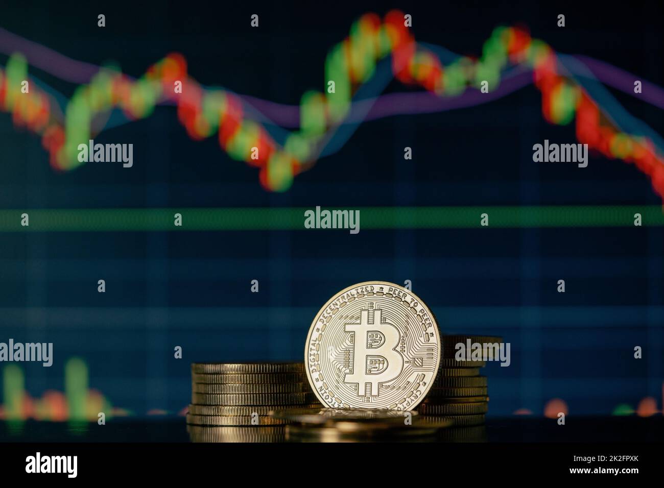 Gold Bitcoins with candle stick graph chart and digital background ...