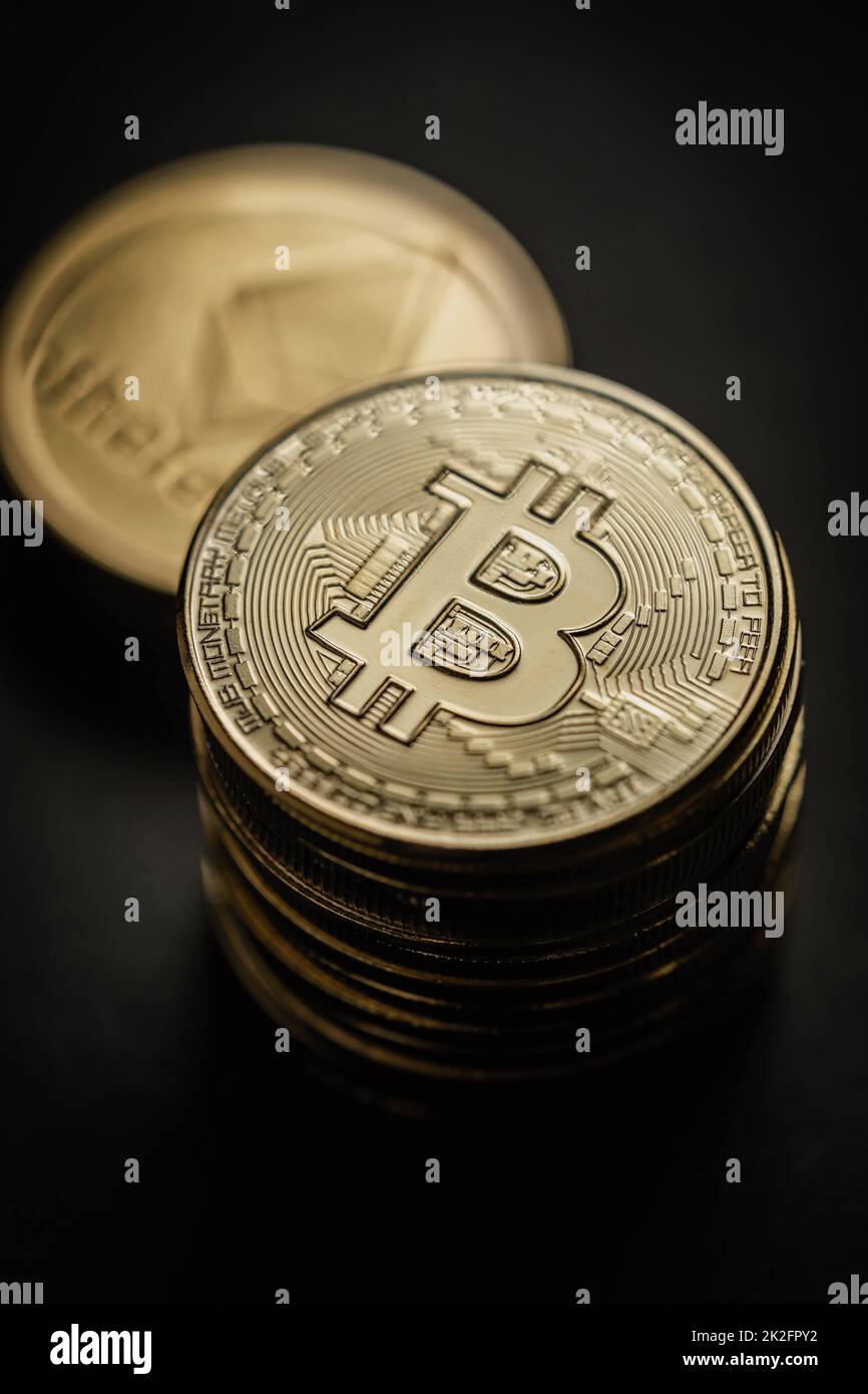 Bitcoin and Ethereum digital cryptocurrency Stock Photo - Alamy