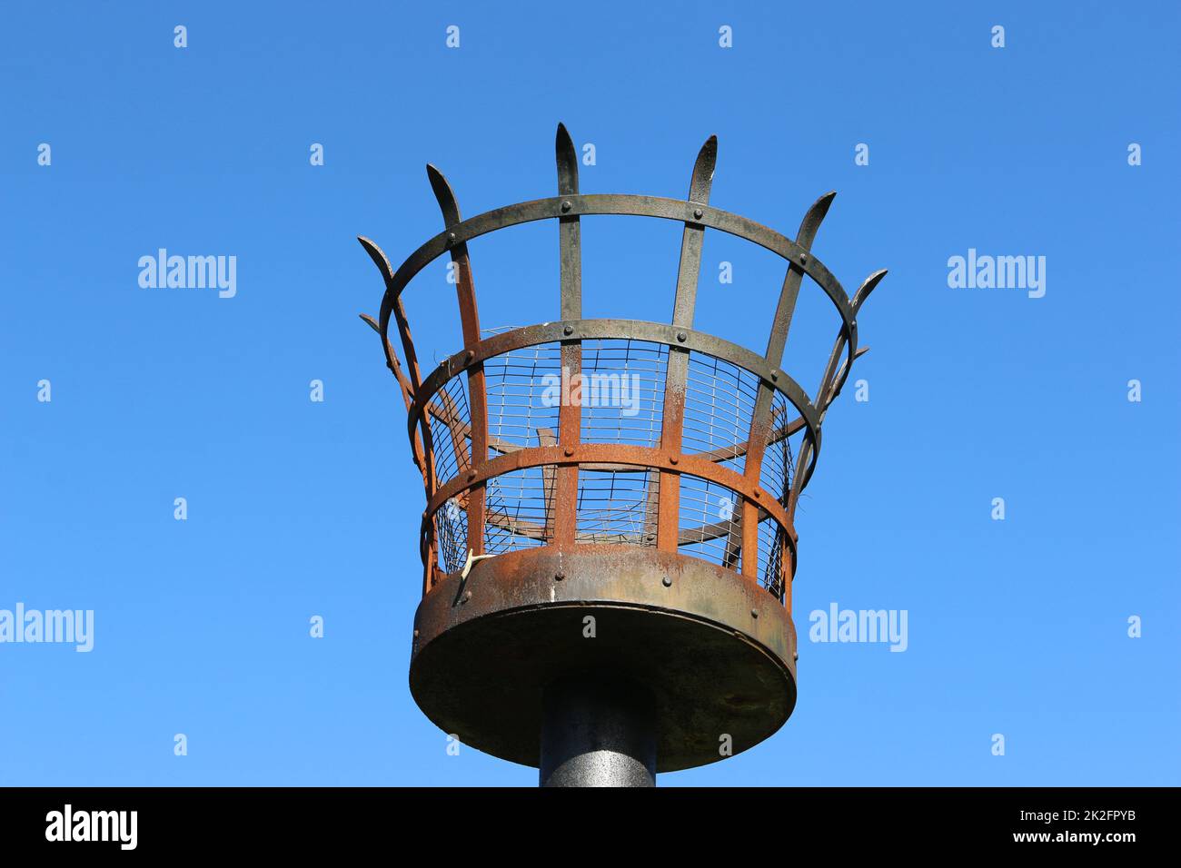 Metal basket fire beacon on pole Stock Photo - Alamy