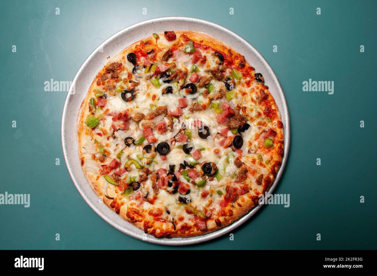 Delicious Italian Pizza Supreme Stock Photo - Alamy