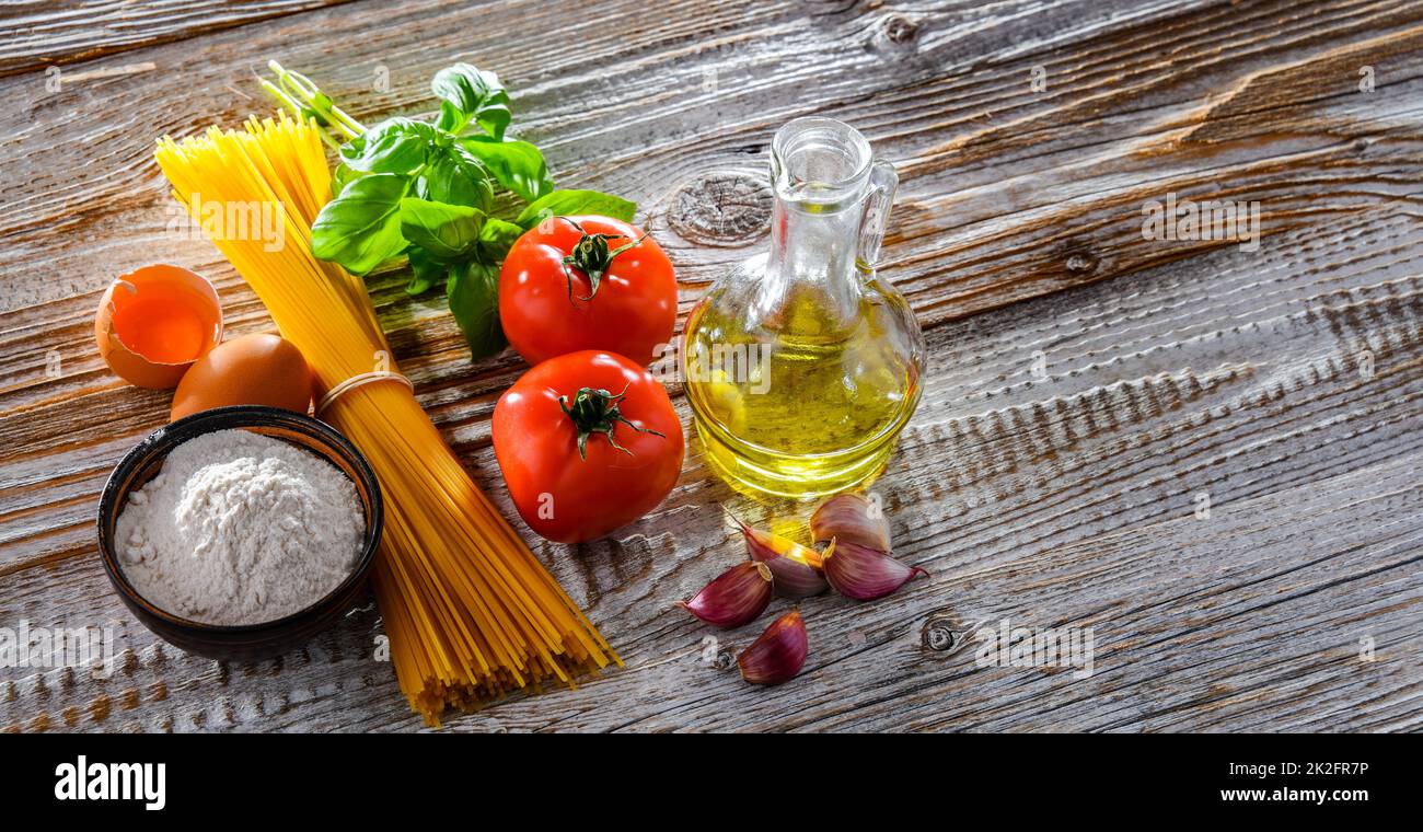 Composition with dried spaghetti, and pasta ingredients Stock Photo - Alamy