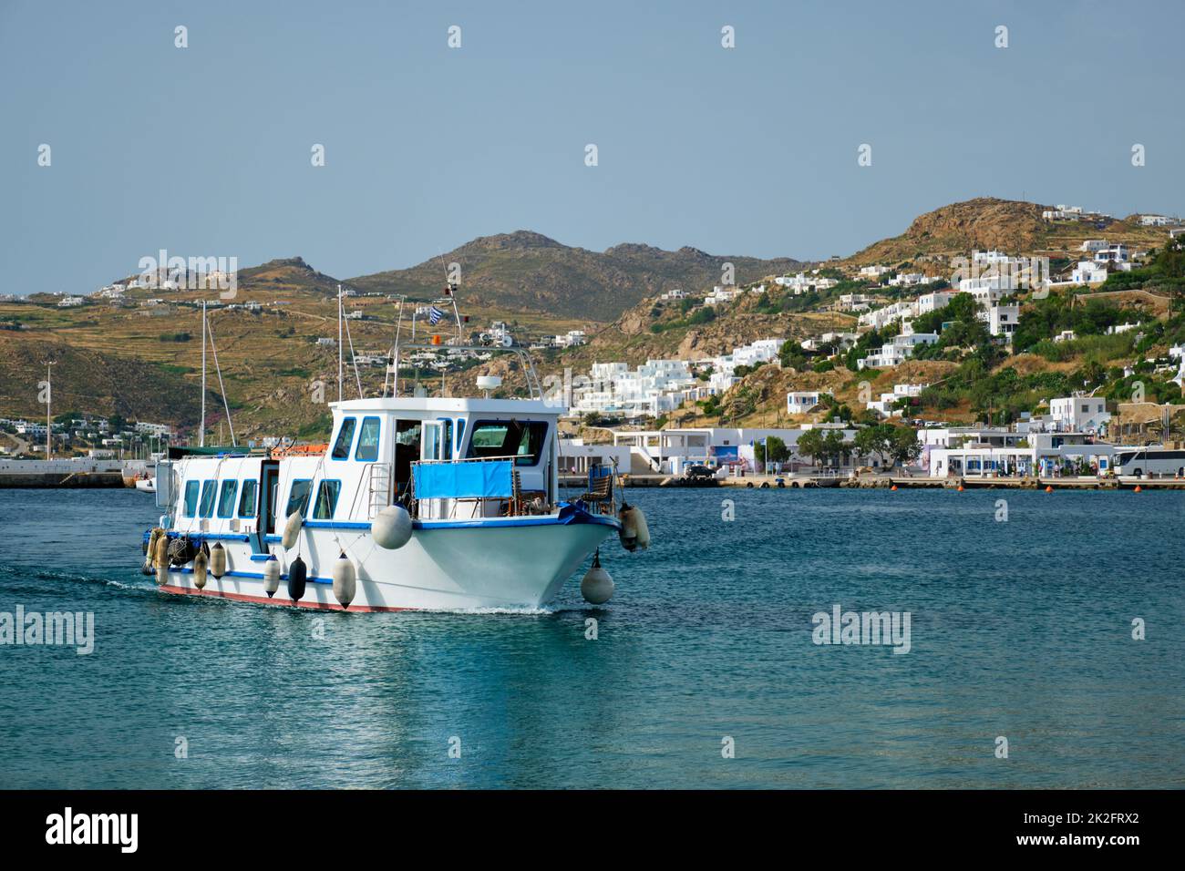 Boat in port harbor of Chora town on Mykonos island, Greece Stock Photo ...