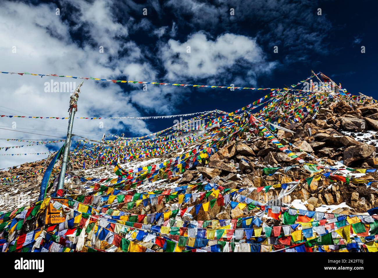 Tibetan Buddhist prayer flags on top of Khardung La pass. Highest ...