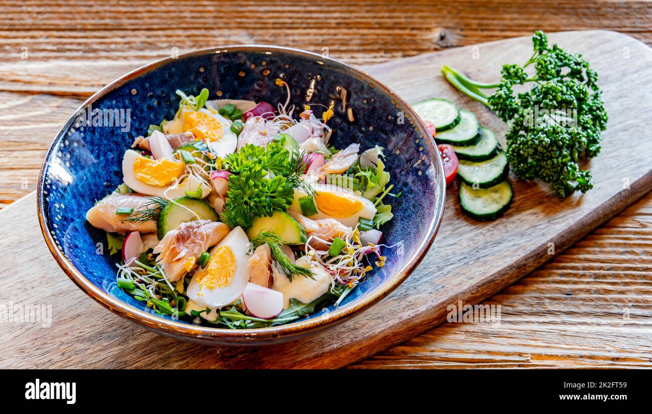 A plate of vegetable salad with trout and eggs Stock Photo - Alamy