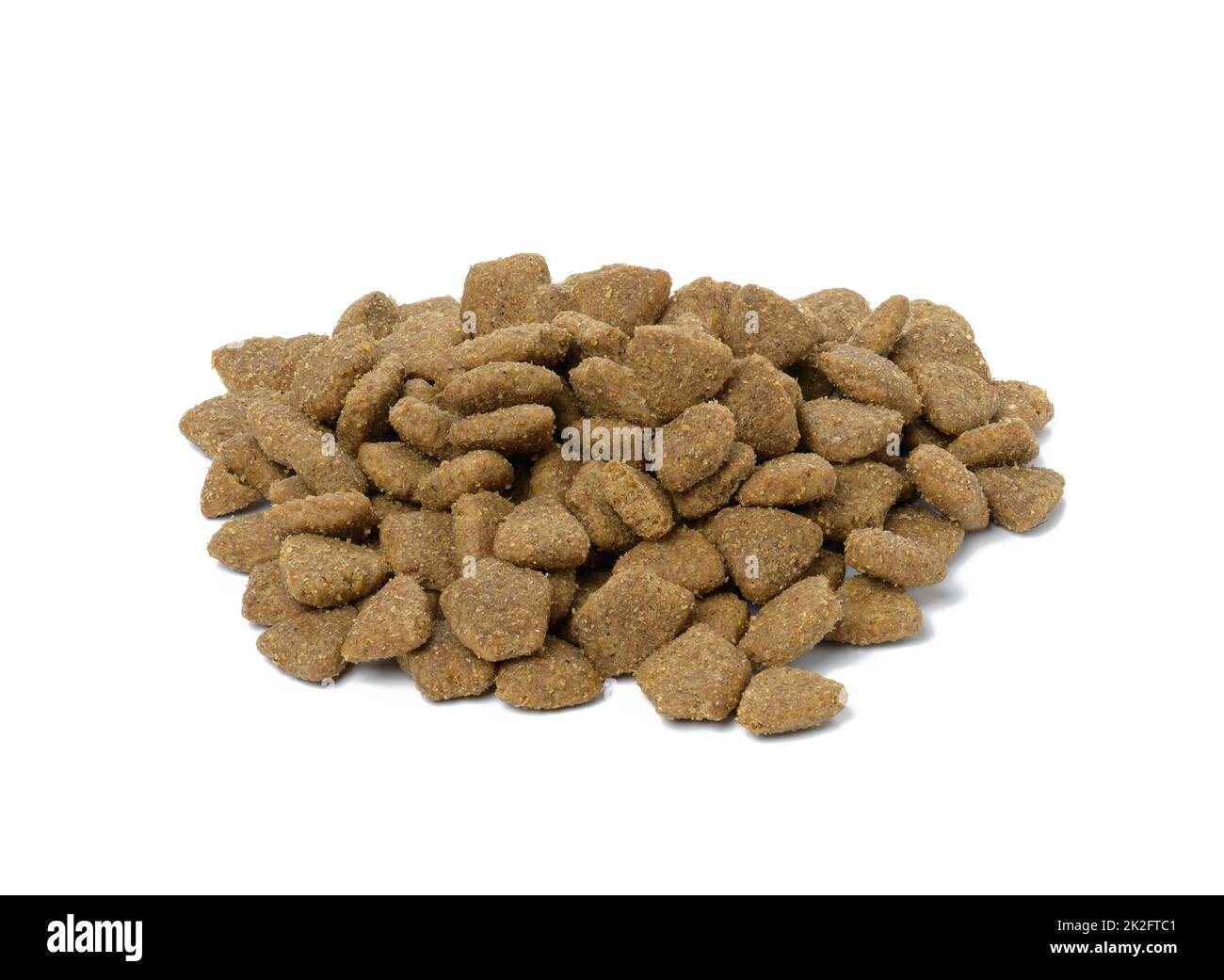 triangular pieces of animal food on a white background. Pile of ...