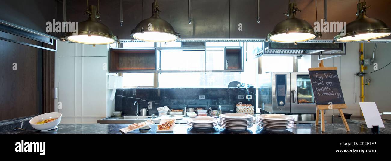 Open area kitchen for breakfast. Dishes and food samples were placed on ...