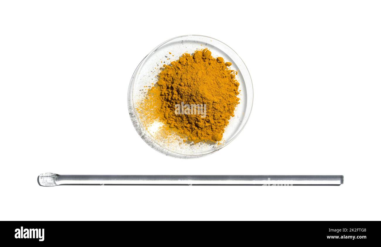 Organic Curcuma Powder in chemical watch glass placed next to stirring ...
