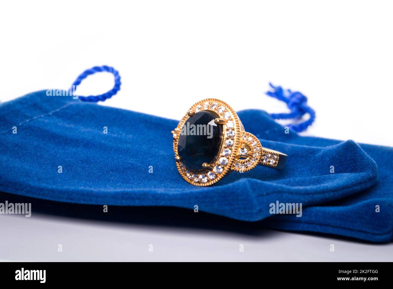 Blue Sapphire and Diamond Jewel or gems ring on velvet bag. Collection ...