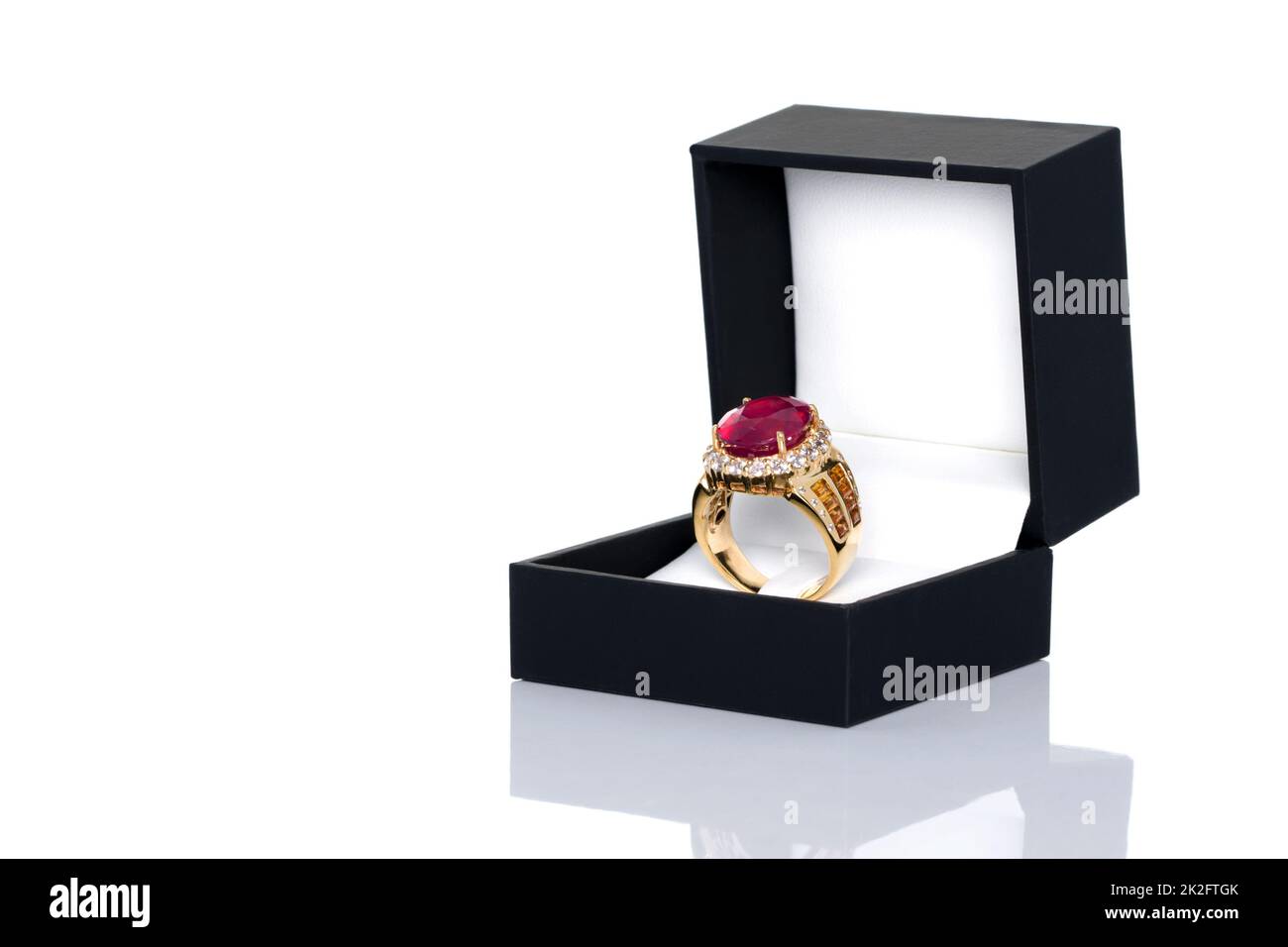 Burma Ruby with orange sapphires and white quartz ring in black jewel ...