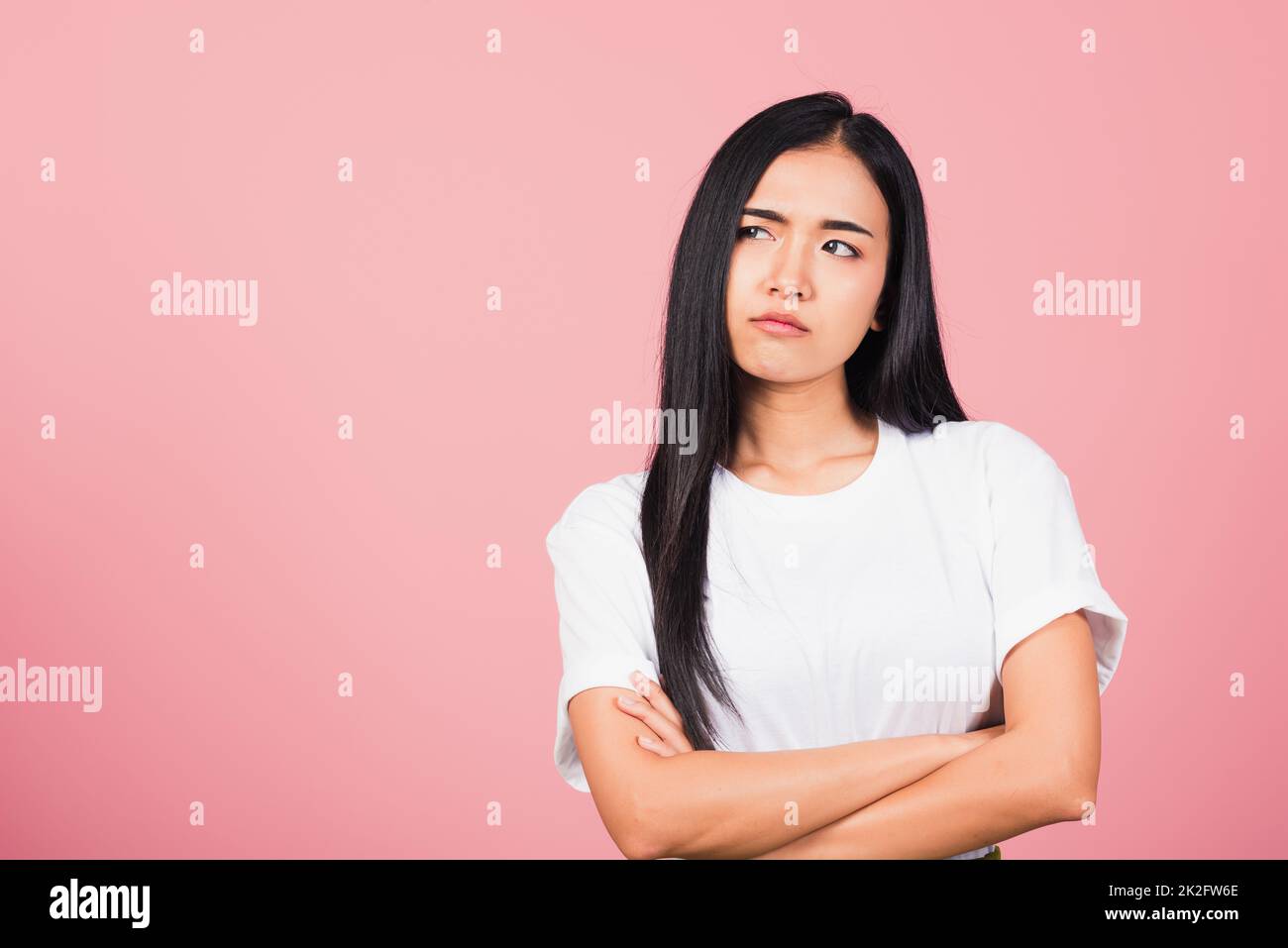 woman standing with crossed arms angry and mad raising fist frustrated ...