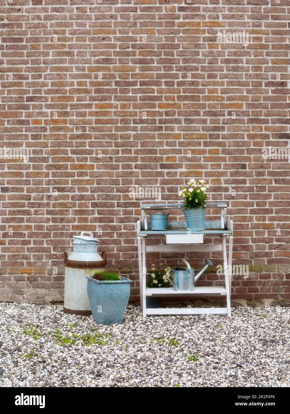 Rustic garden decoration. A rsutiv garden display of potted plants with ...