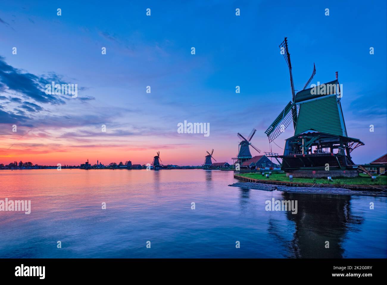 Windmills at famous tourist site Zaanse Schans in Holland with dramatic ...