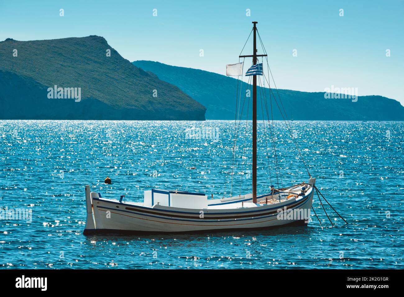 Traditional greek fishing boat in the aegean sea, Greece Stock Photo ...