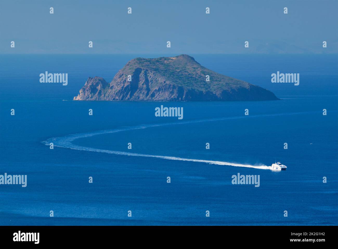 Speeding speed boat catamaran ship in Aegean sea near Milos island in ...