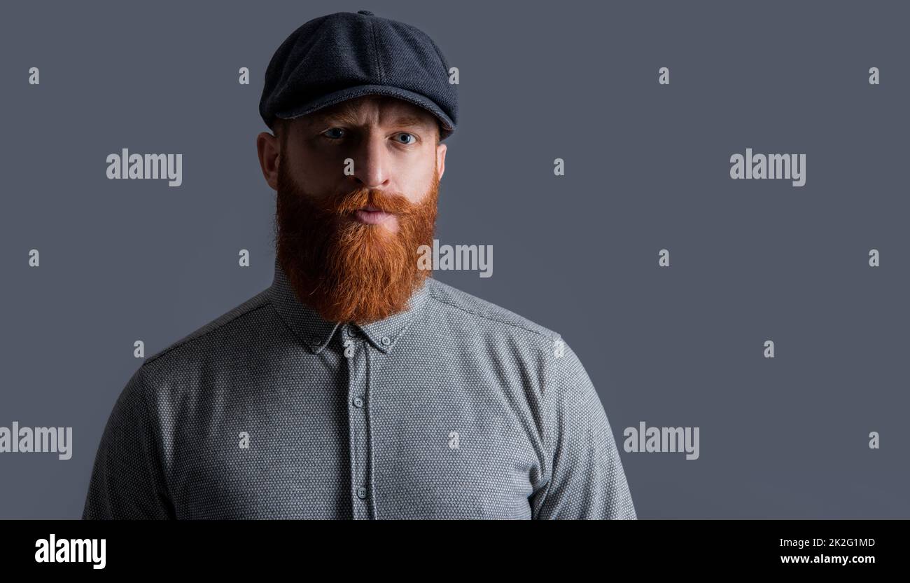 Portrait of Irish man isolated on grey. Bearded man with serious face ...